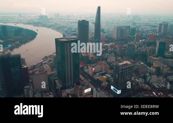 sunset over modern Ho Chi Minh city skyline and Saigon river, financial ...