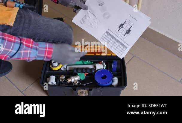 Gloved plumber points datasheet while verifying o ring drawing ...