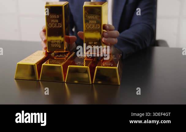 Business success man with gold bar. Investment in precious metal ...