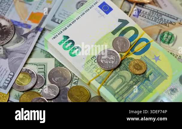 Smoothly rotating background with US Dollar and Euro bills and BTC ...