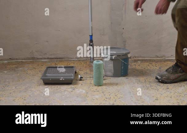 Painting preparation process as worker removes and places the paint ...