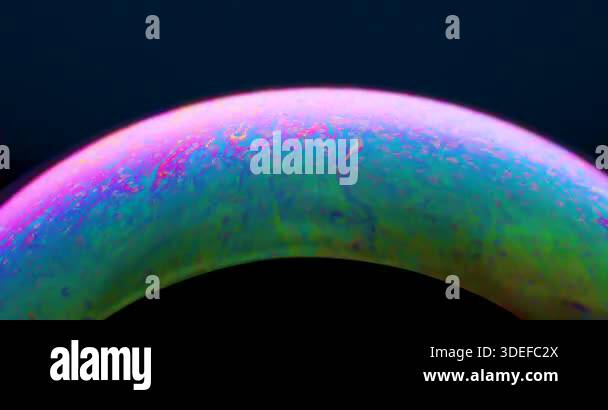 Colorful soap bubble floating gracefully in a close-up 4K video ...