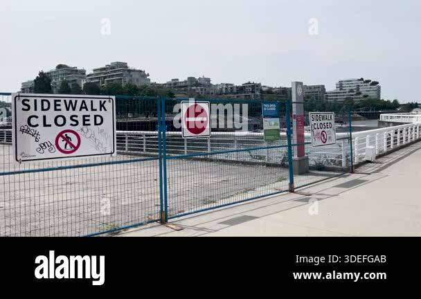 Vancouver, Canada - June 24,2025: Sidewalk closed signs and blue ...