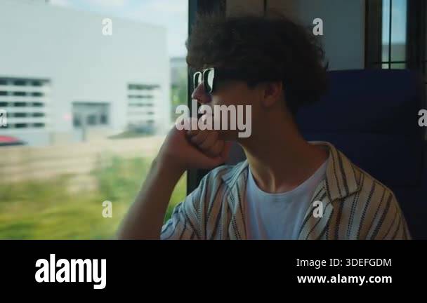 Youth gazing outside, Teen looking through train window, Young person ...
