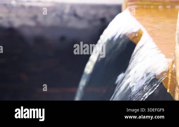Water flows over a wooden dam structure Stock Video Footage - Alamy