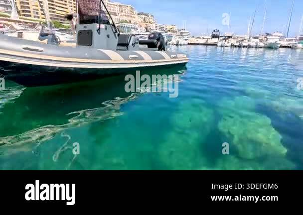 Boat on water, underwater rocks and fish Stock Video Footage - Alamy