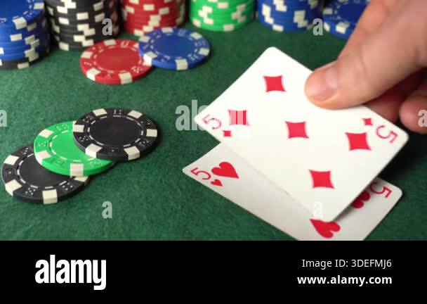 A player's hand places four fives or a combination of quads on the ...