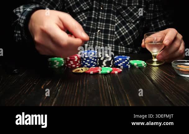 A gambler skillfully rolls dice onto the table, displaying a ...