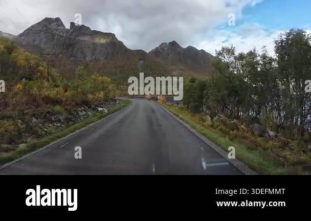 Scenic road trip view from a motorhome driving along a fjord in Senja ...