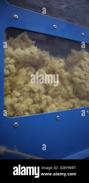 Close Up Fibers Churn in Industrial Drum Behind Scratched Panel. Beige ...