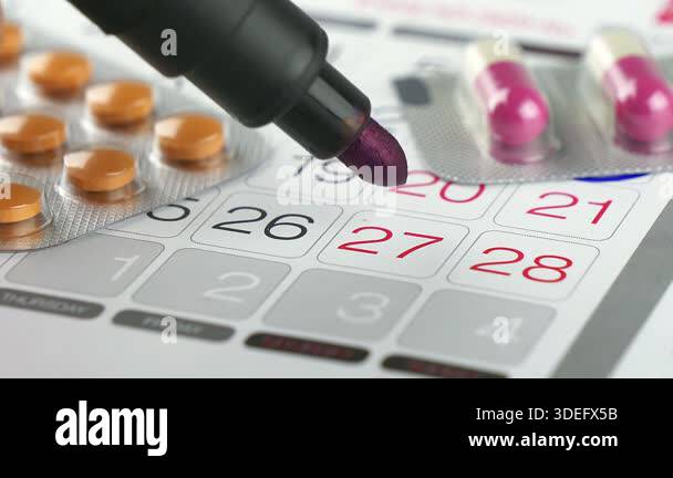 A close view of a calendar with highlighted dates and prescription ...
