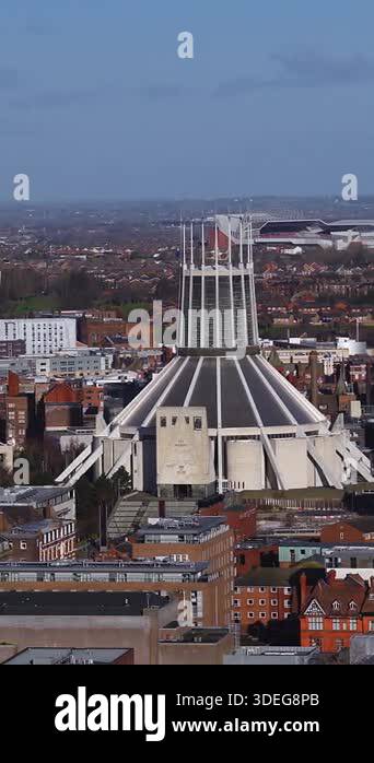 Aerial pan over Liverpool, UK, reveals Metropolitan Cathedral, red ...