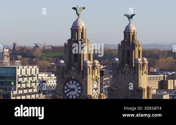 Aerial sunrise focuses on the Royal Liver Building in Liverpool, with ...