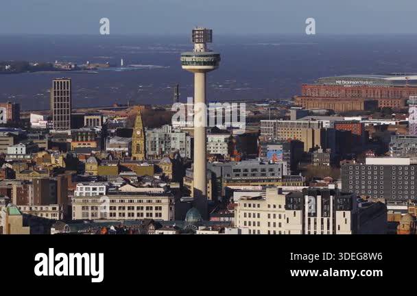 Aerial dawn pan over Liverpool, UK, with Radio City Tower, a clock ...