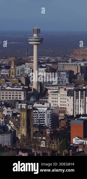 Aerial slow sweeping pan over Liverpool, UK at dawn. Radio City Tower ...