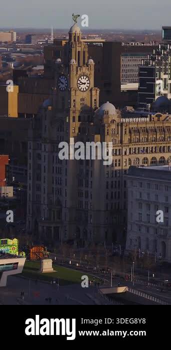 Aerial drone sweep shows Royal Liver Building at Pier Head in Liverpool ...