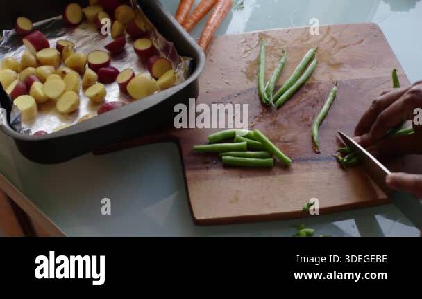 Person hands preparing vegetables on wooden cutting board Stock Video ...