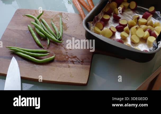 Person hands preparing vegetables on wooden cutting board Stock Video ...