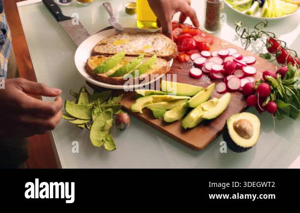 person making healthy vegan tartine sandwich Stock Video Footage - Alamy