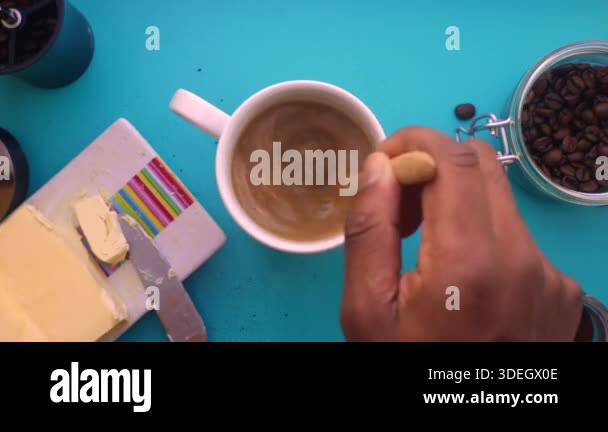 person preparing coffee with butter and MCT oil Stock Video Footage - Alamy