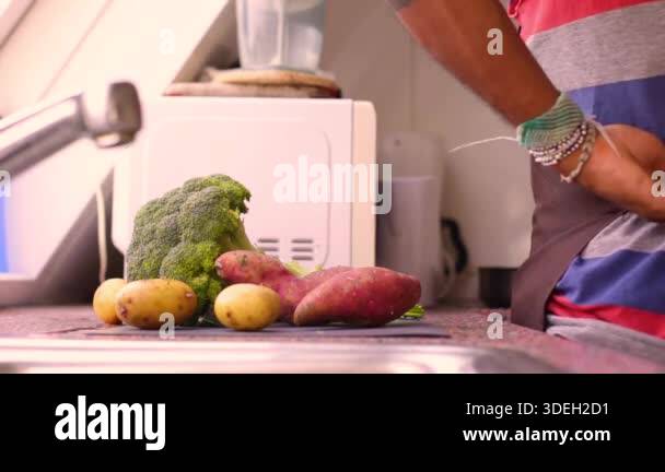 Person preparing organic food in kitchen for healthy meal Stock Video ...