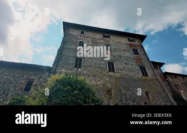 Ancient stone fortress with massive walls under cloudy sky. Medieval ...