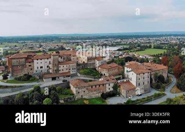 Old stone houses and church in medieval Italian hamlet. Traditional ...