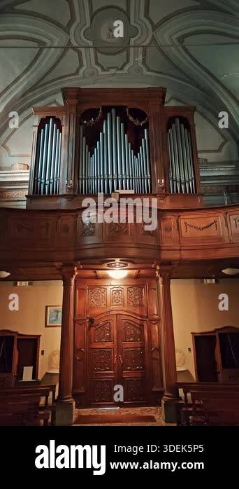 Majestic organ in catholic temple with wooden pipes and decorative ...