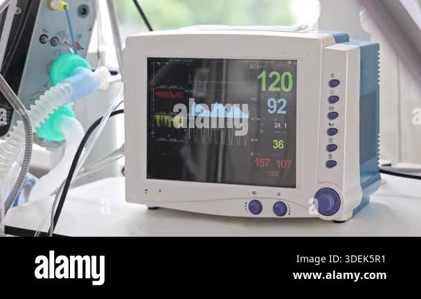 Modern patient monitor screen displaying vital signs in intensive care ...