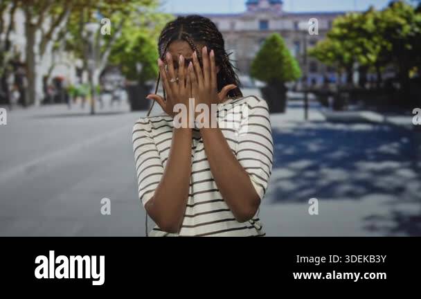 African american woman with hands raised and concerned expression on a ...