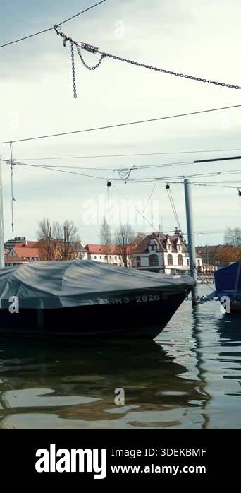 Fishing wharf in town. Small fishing boat mooring in harbor in Konstanz ...