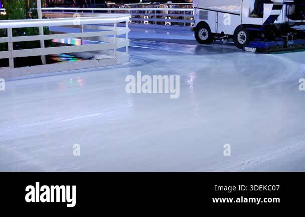 Large ice resurfacing machine maintaining a smooth surface on a bright ...