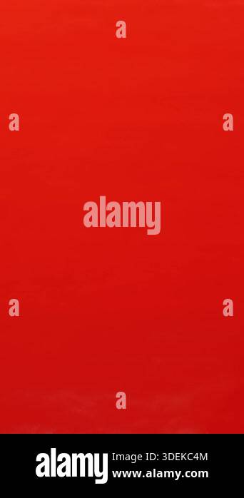 Hand is giving present gift box with red ribbon bow on red background ...