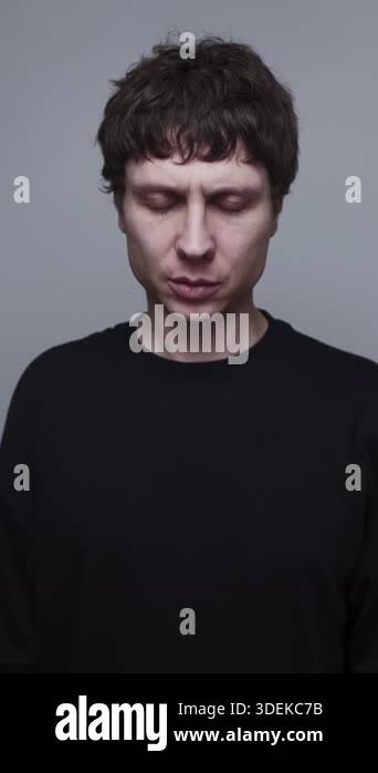 Corporate smile hiding true feelings. Man switches from negative ...