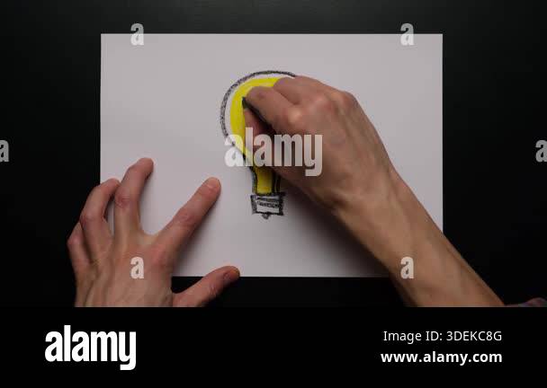 Creative idea takes shape as hands draw a glowing light bulb with ...