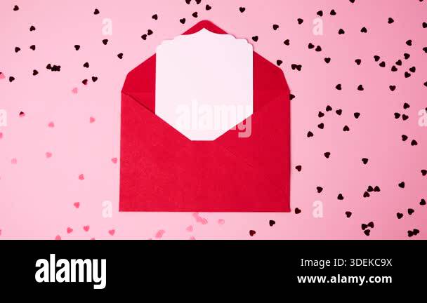 Open red envelope with blank white card surrounded by heart confetti ...