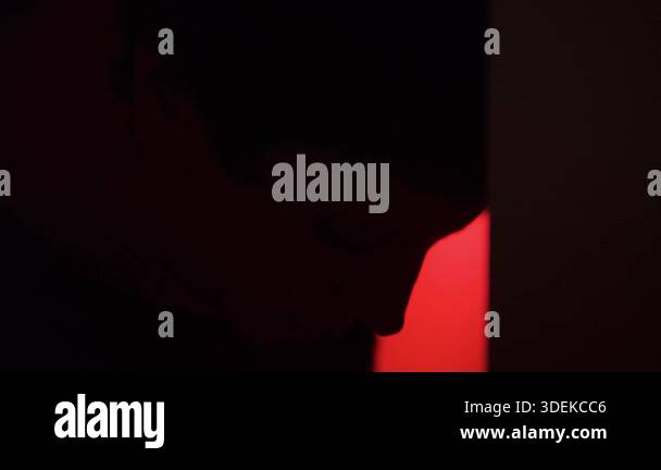 Emotional numbness and dissociation shown in red light as a man freezes ...
