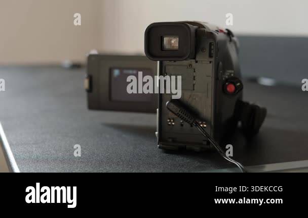 Vintage VHS camcorder close-up as cassette door opens, analog recording ...