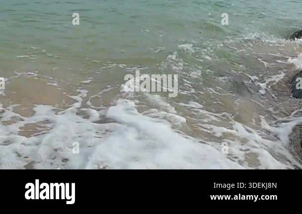 Beautiful waves forming energy and foam coastal scene. High quality 4k ...
