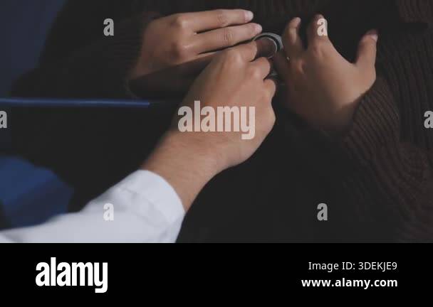 Doctor using a stethoscope checking patient with examining, presenting ...