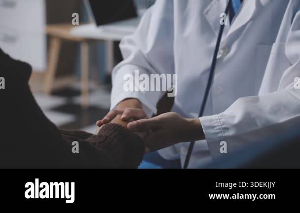 Doctor using a stethoscope checking patient with examining, presenting ...