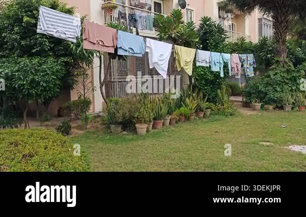 Clothes are drying by hanging on a line in the sun Stock Video Footage ...