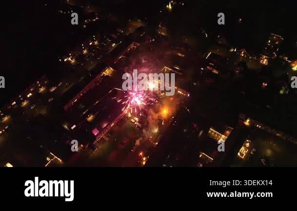 Aerial footage of lots of fireworks going into the sky at new years eve ...