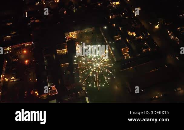 Aerial footage of lots of fireworks going into the sky at new years eve ...