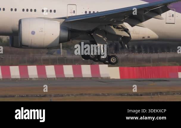Wide body airplane landing at Bangkok Airport, side view. Airplane ...