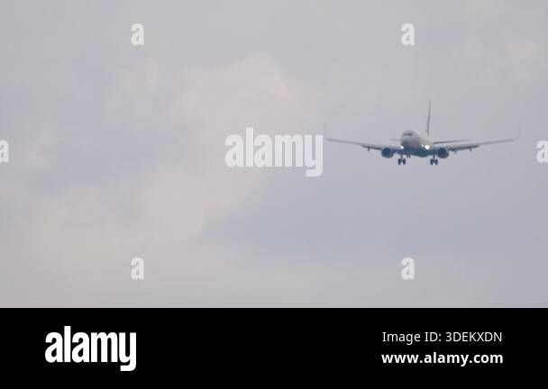 Jet passenger plane with unrecognizable livery approaching landing ...