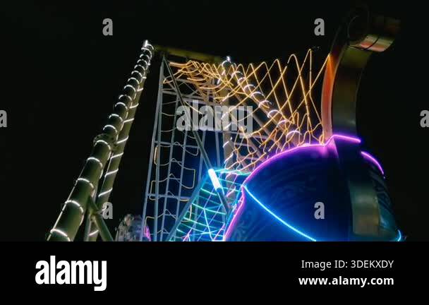 Cinematic night market ferris wheel, under the spotlight of colorful ...