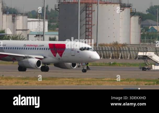 ALMATY, KAZAKHSTAN - JUNE 25, 2024: Passenger airplane Red Wings Sukhoi ...