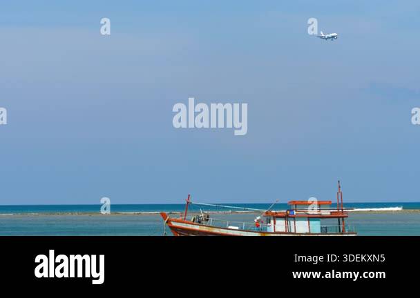 An airliner with an unrecognizable livery, taking off, climbing, rear ...