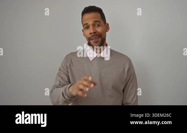 Confident man smiling in casual shirt standing against white background ...